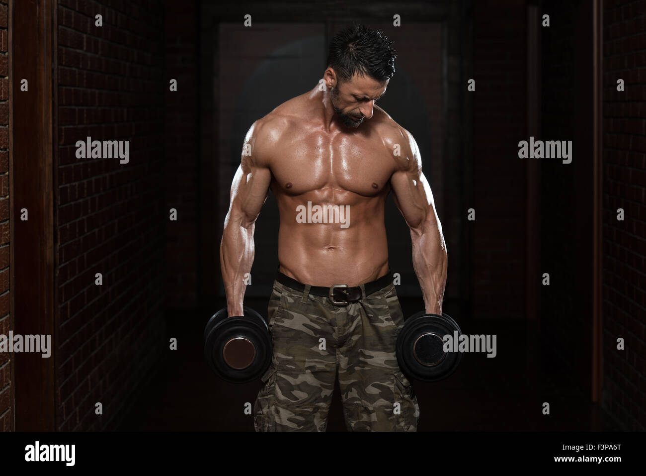 Healthy Man Working Out Biceps - Dumbbell Concentration Curls Stock ...