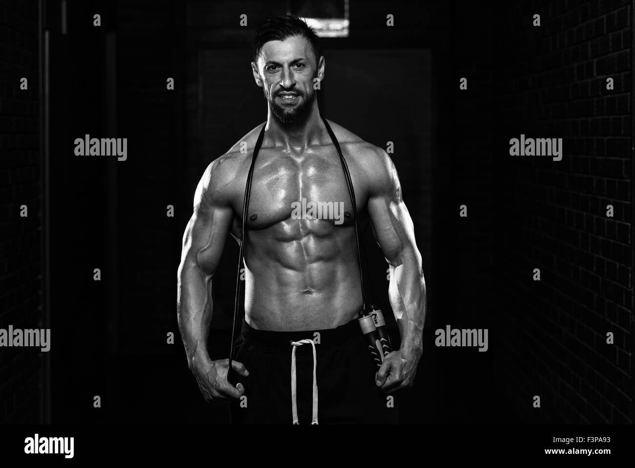 Healthy Muscular Man With Jumping Rope - Cardio Time Stock Photo - Alamy