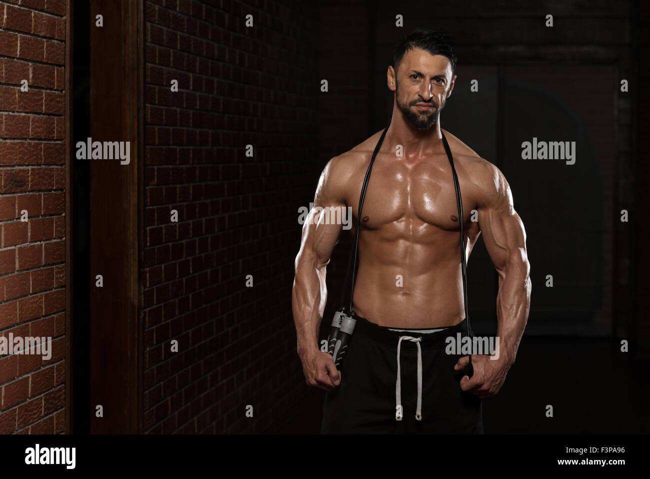 Healthy Muscular Man With Jumping Rope - Cardio Time Stock Photo - Alamy