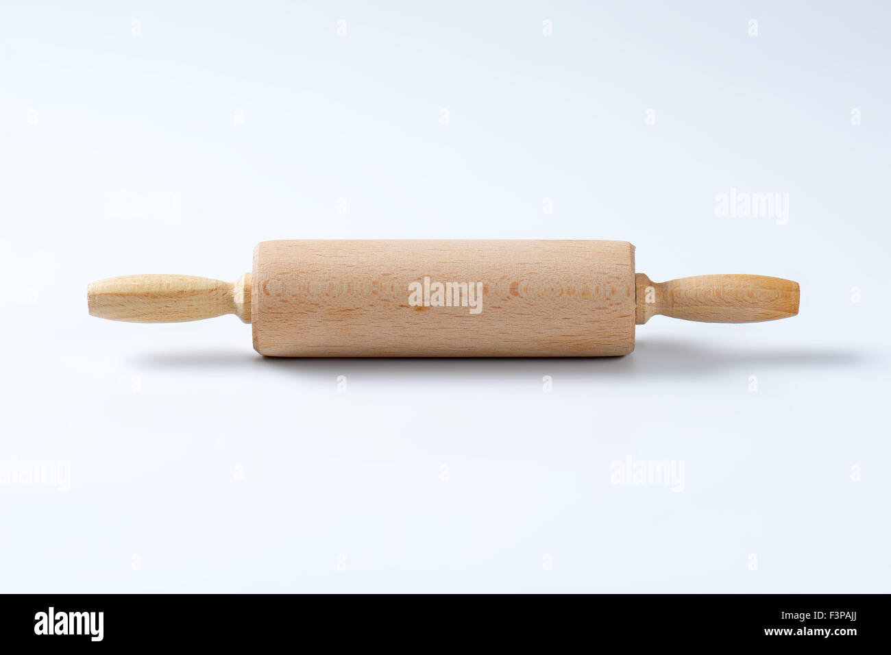 wooden rolling pin on white background Stock Photo - Alamy
