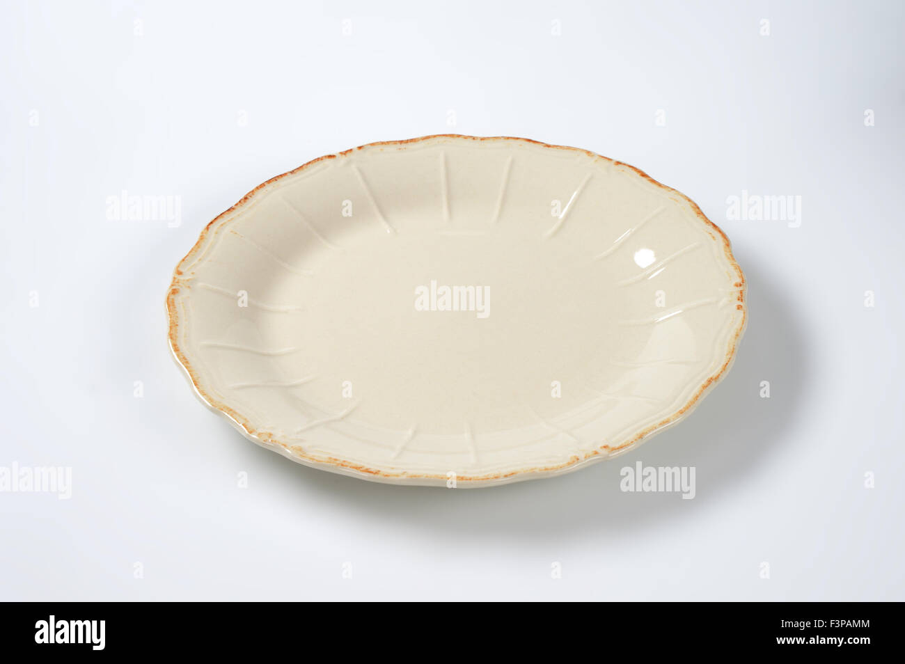 cream decorative plate on white background Stock Photo - Alamy