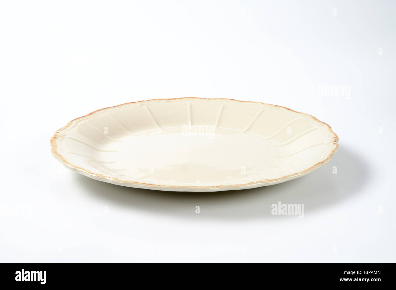 cream decorative plate on white background Stock Photo - Alamy