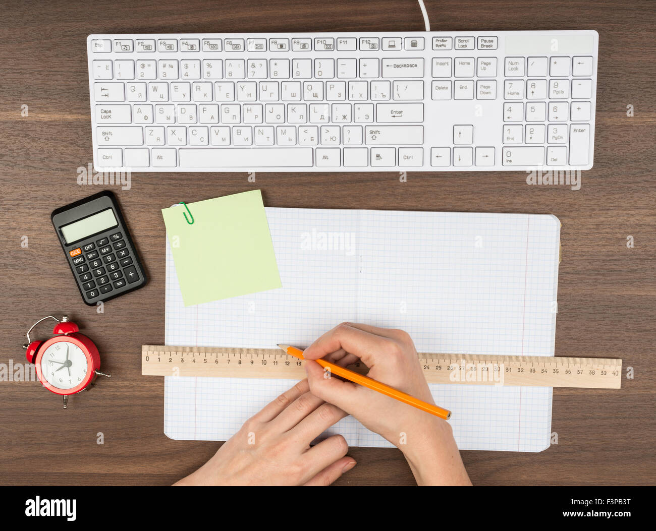 Humans hands with ruler and pencil Stock Photo - Alamy