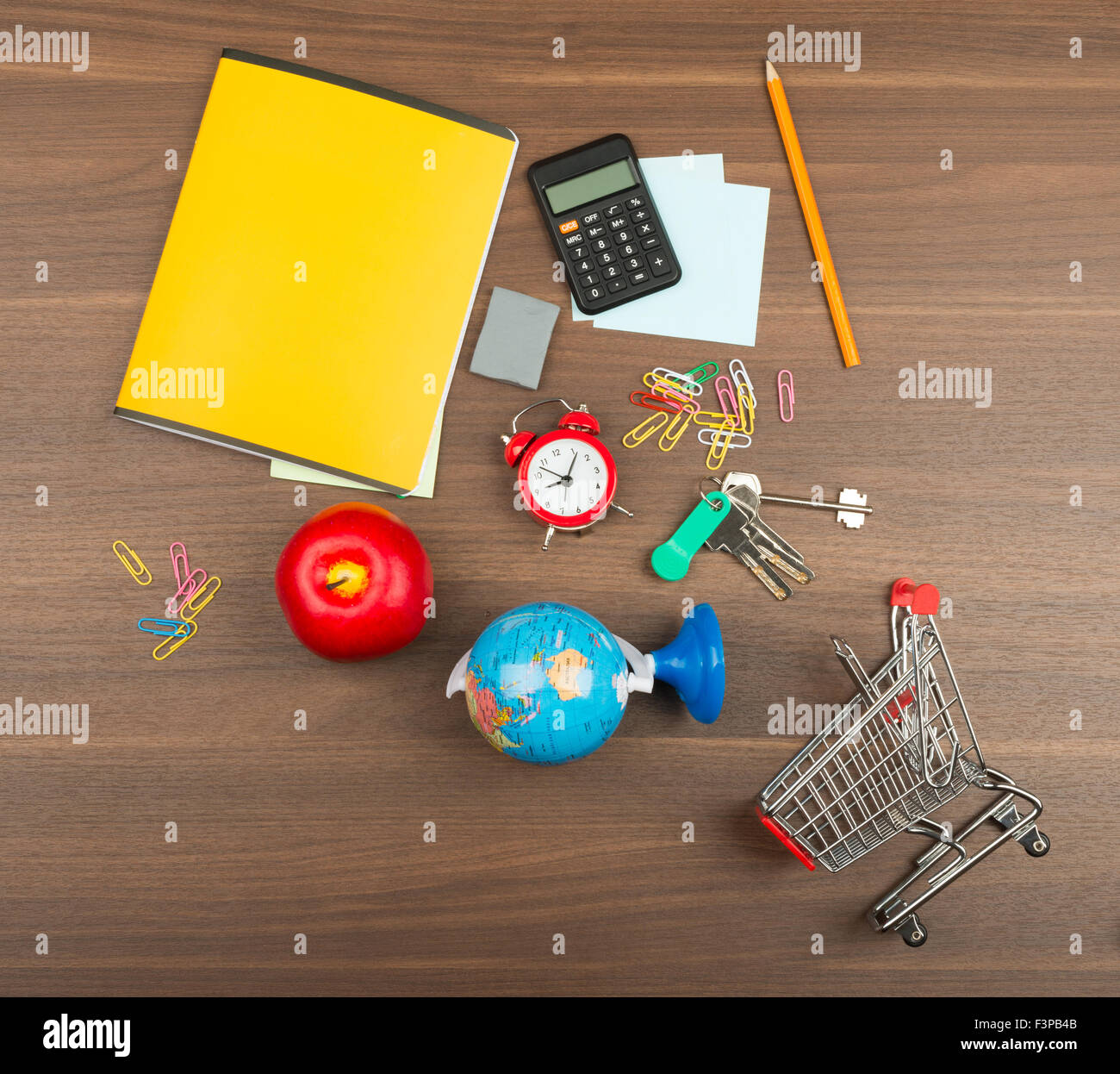 Shopping cart with office supplies Stock Photo - Alamy