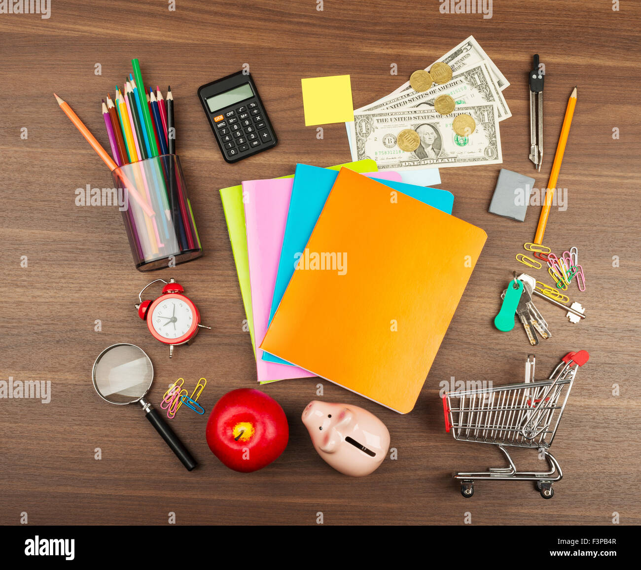 Shopping cart with office supplies and keys Stock Photo - Alamy