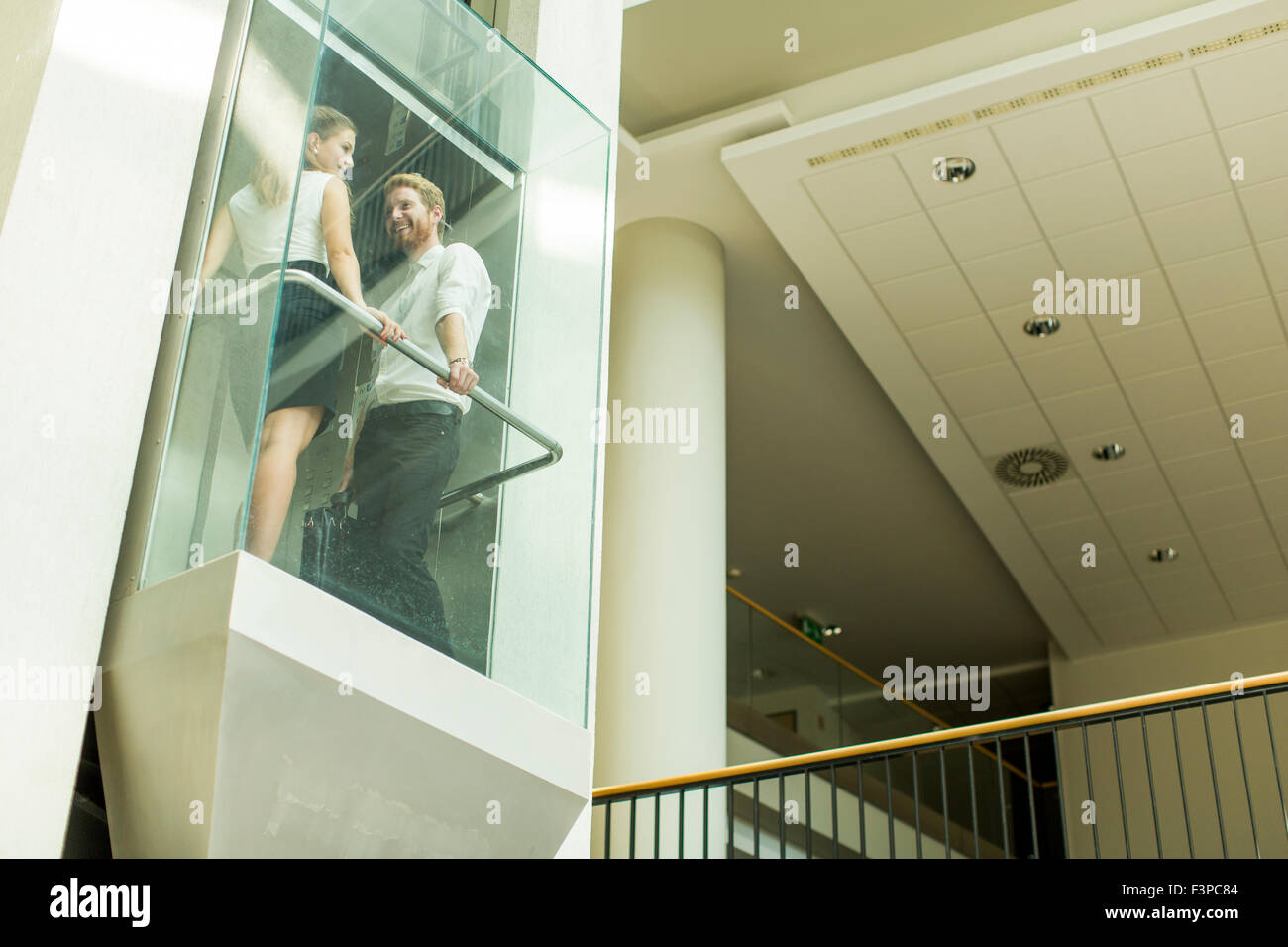 Business people standing in elevator hi-res stock photography and ...