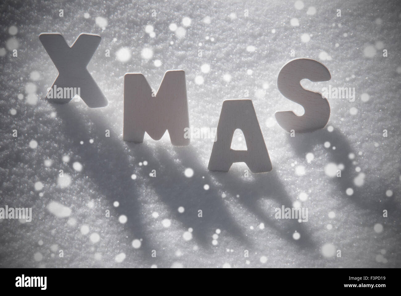 White Christmas Text Xmas On Snow, Snowflakes Stock Photo - Alamy