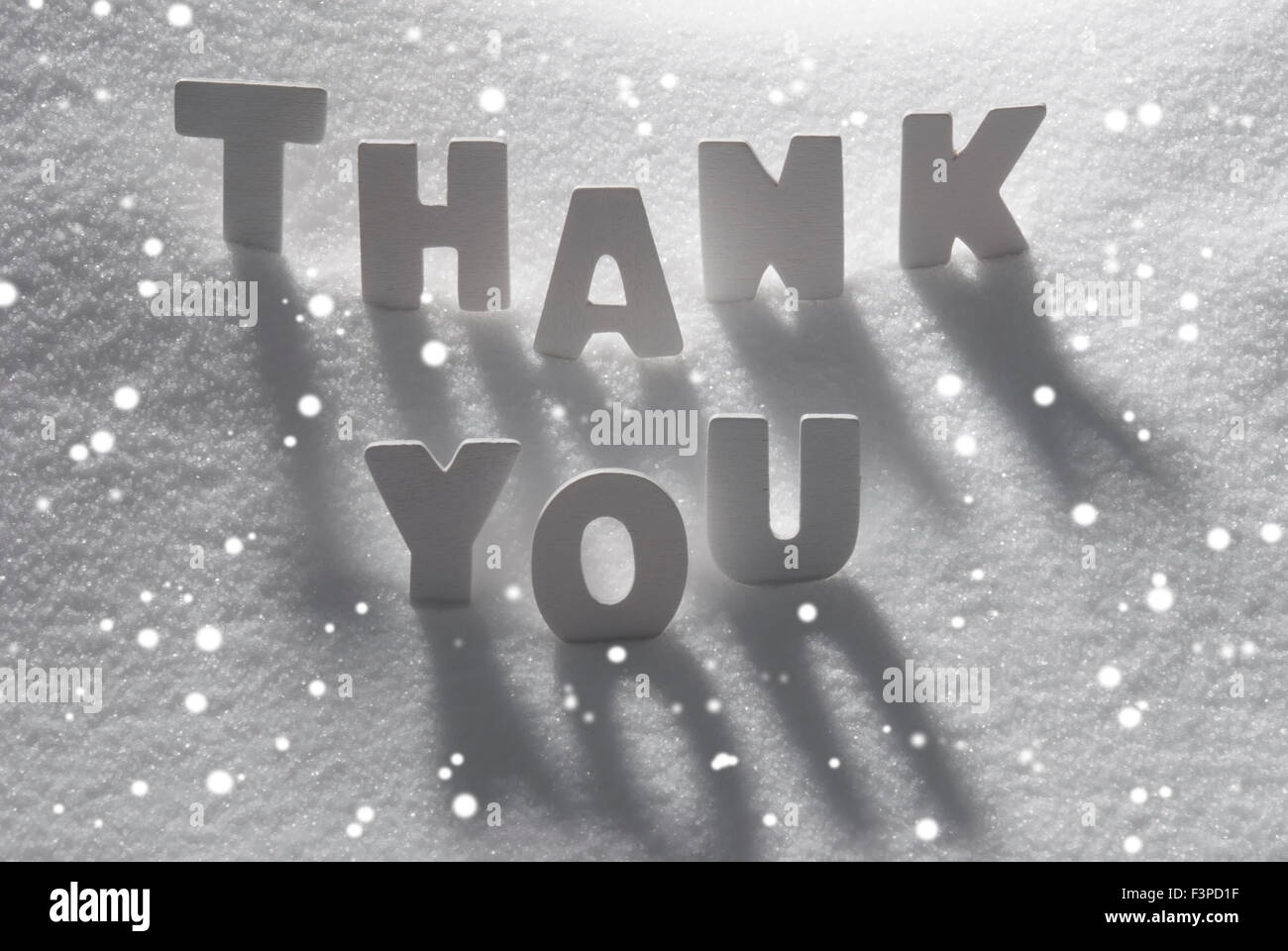 White Word Thank You On Snow, Snowflakes Stock Photo - Alamy