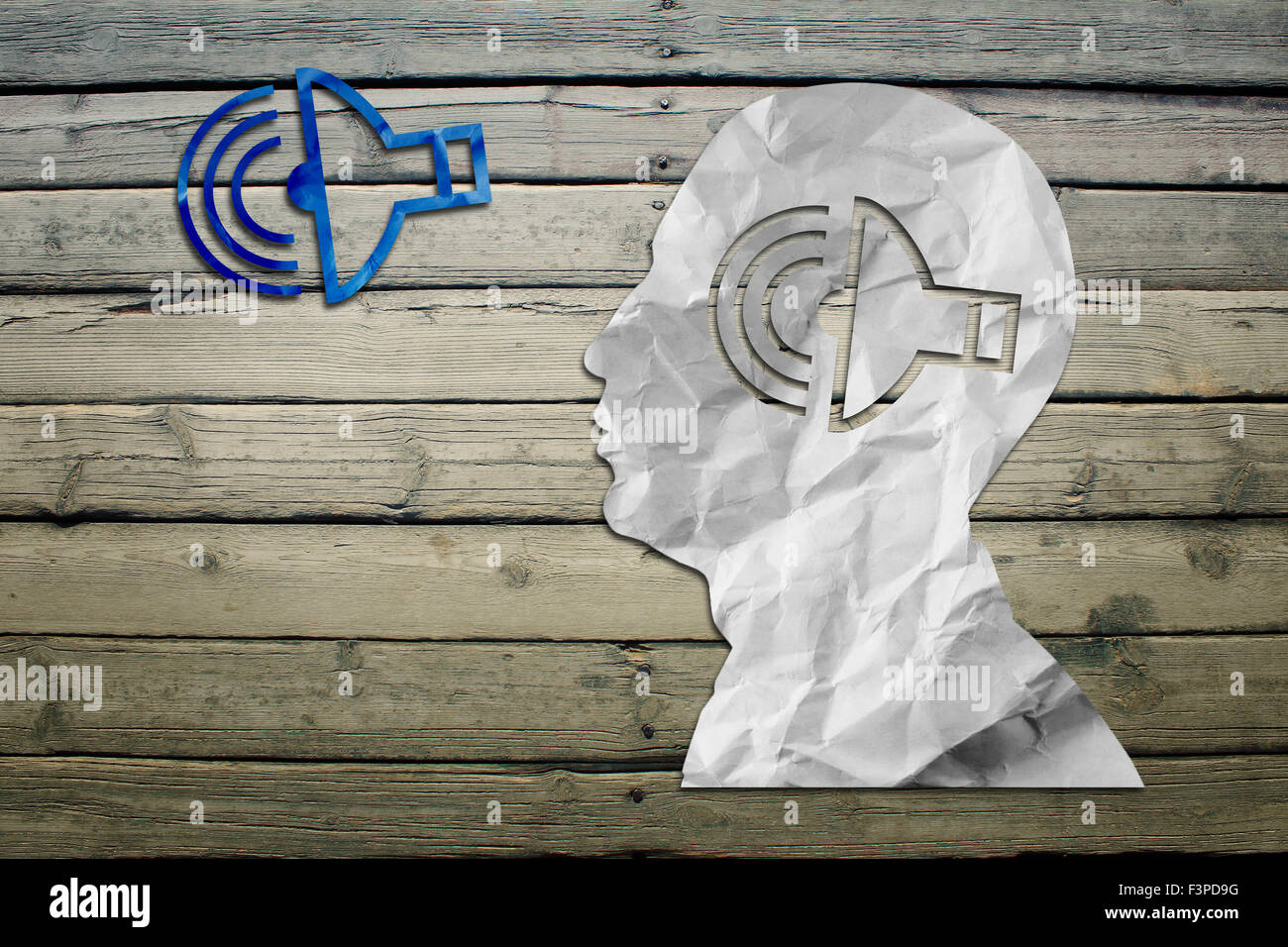 Paper humans head with sound symbol Stock Photo - Alamy