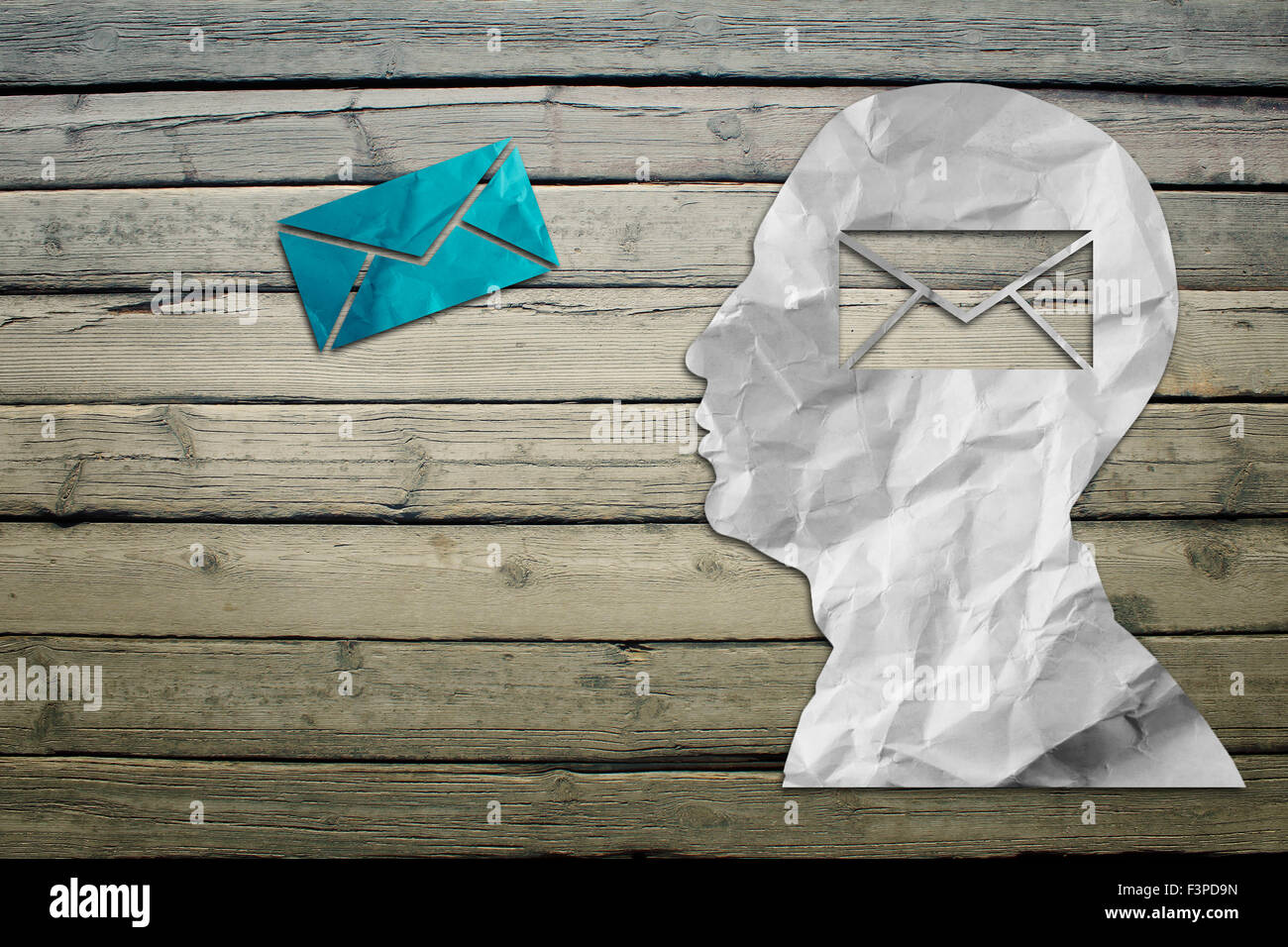 Paper humans head with envelope symbol Stock Photo - Alamy