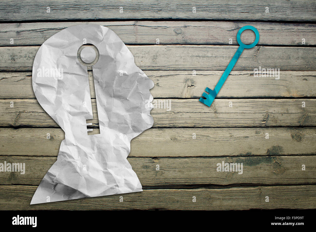 Paper humans head with key symbol Stock Photo - Alamy