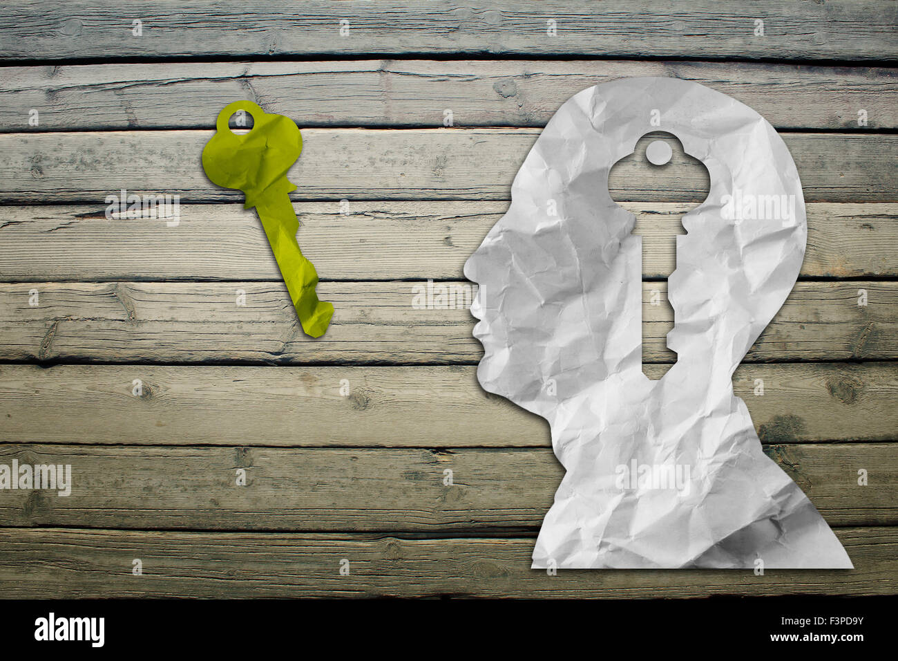 Paper humans head with key sign Stock Photo - Alamy