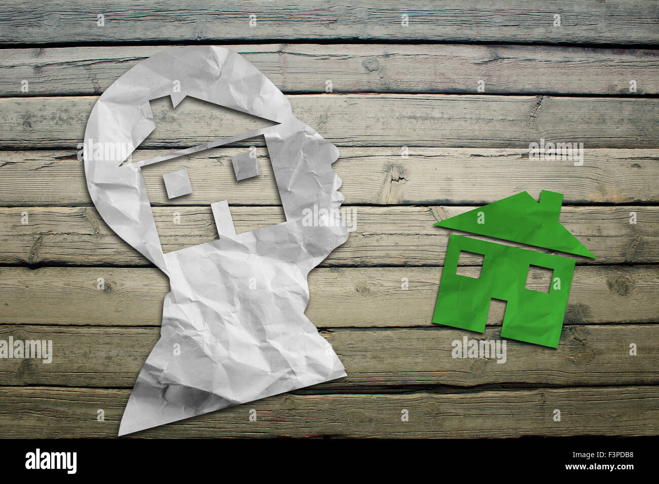 Paper humans head with house symbol Stock Photo - Alamy