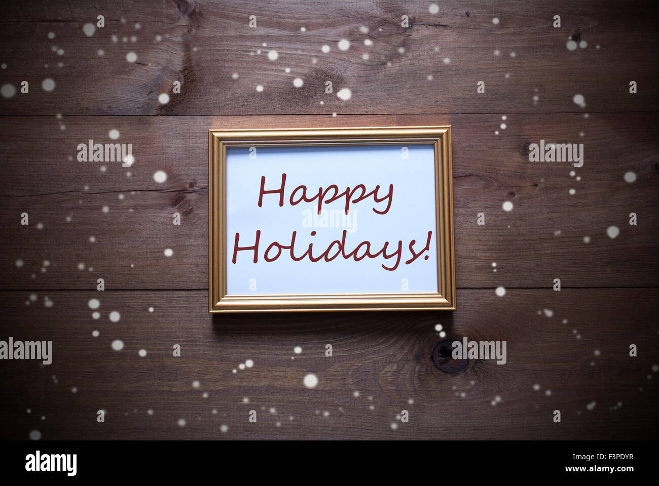 Golden Picture Frame With Happy Holidays And Snowflakes Stock Photo - Alamy
