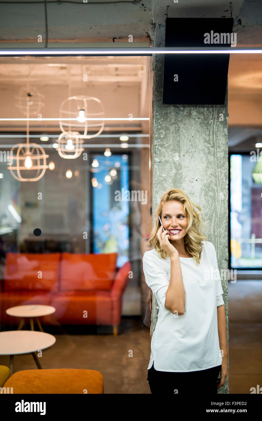 Young woman with mobile phone Stock Photo - Alamy