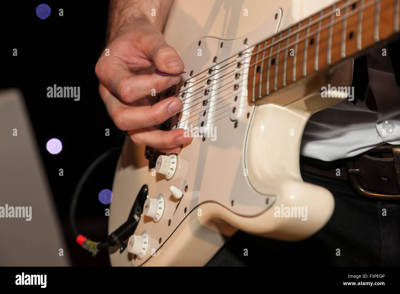 Electric Fender guitar being played Stock Photo - Alamy