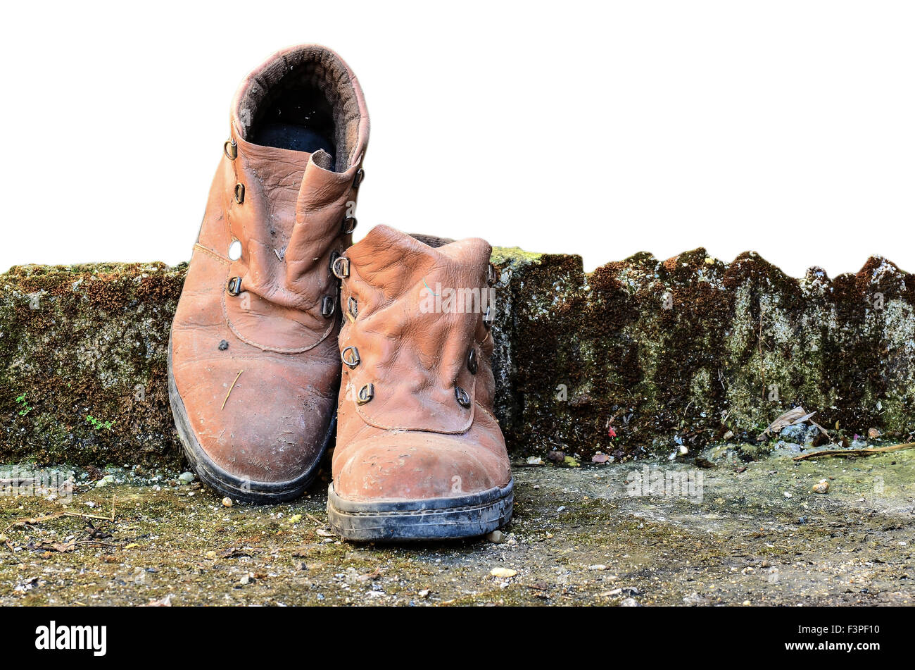 Dirty old shoes on white background Stock Photo - Alamy