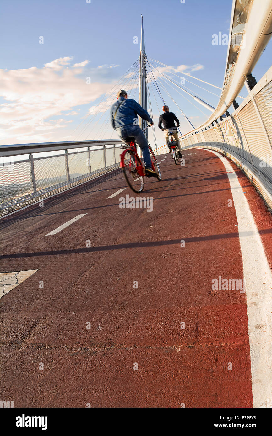 Cyclist on suspension bridge hi-res stock photography and images - Alamy