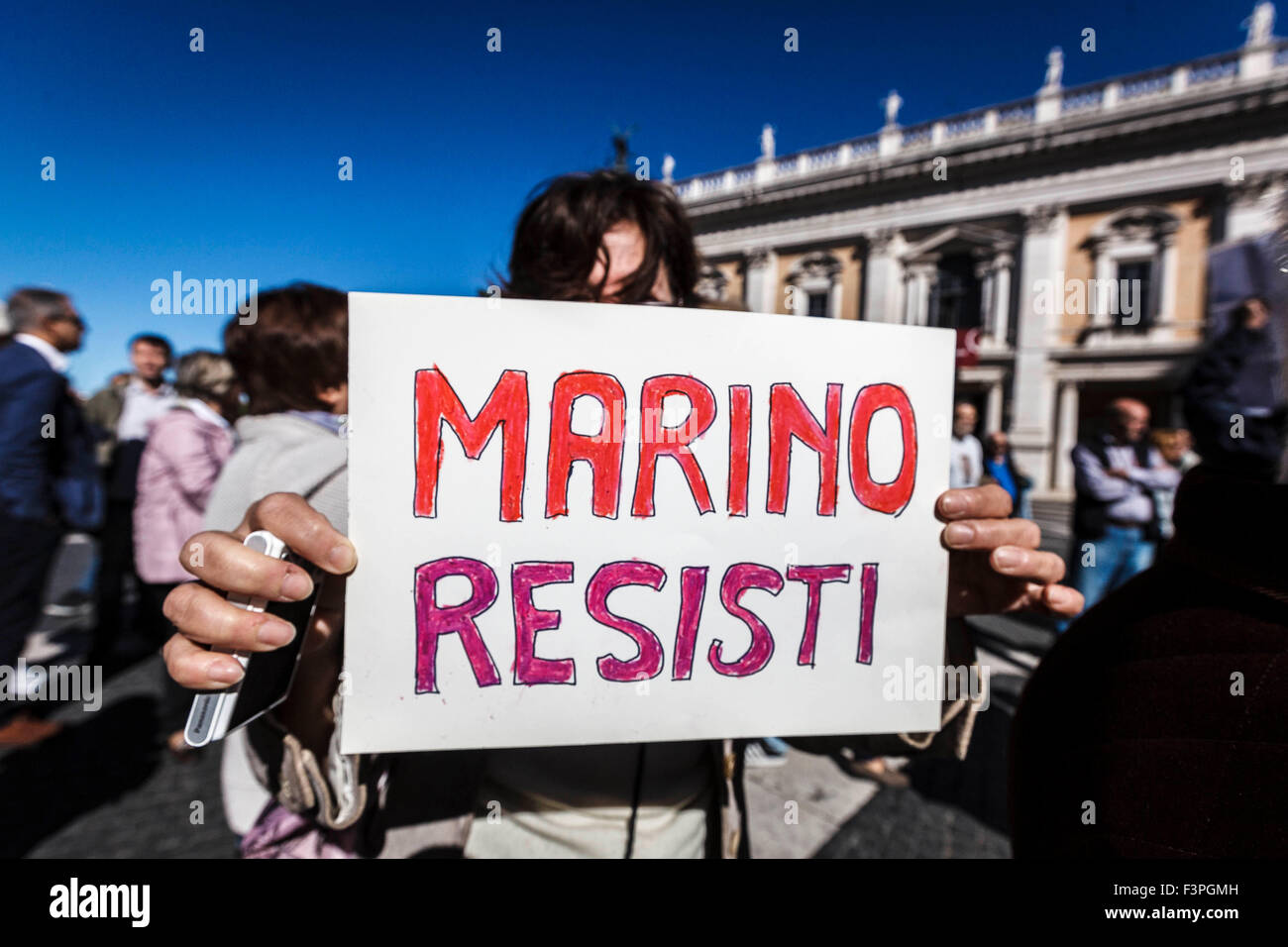 Rome, Italy. 11th Oct, 2015. A demonstrator holds a sign reading ...
