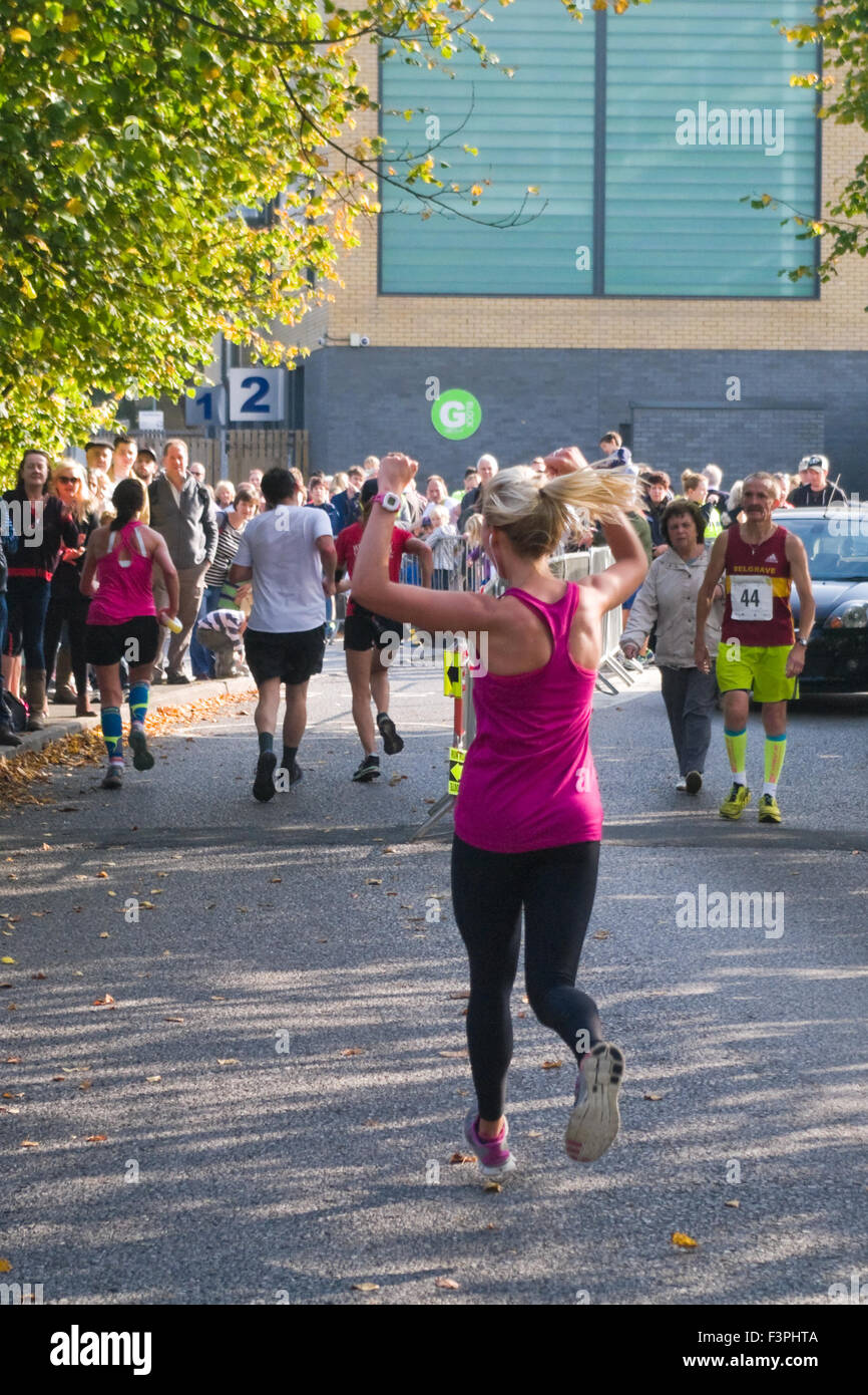 Chichester, West Sussex, England, 11th September 2015. A female runner ...