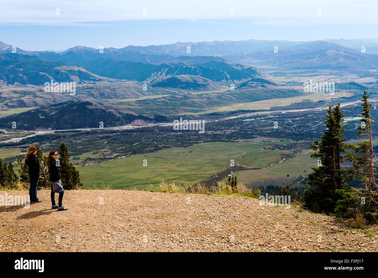 Summer tourists enjoy the view from the top of Jackson Hole Mountain ...