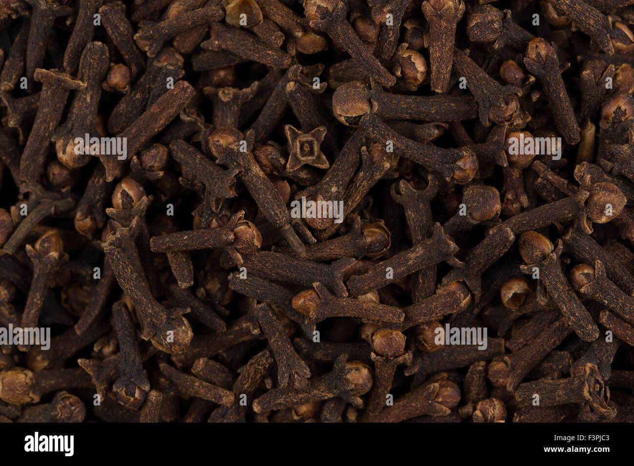 Cloves spice close up as a background Stock Photo - Alamy