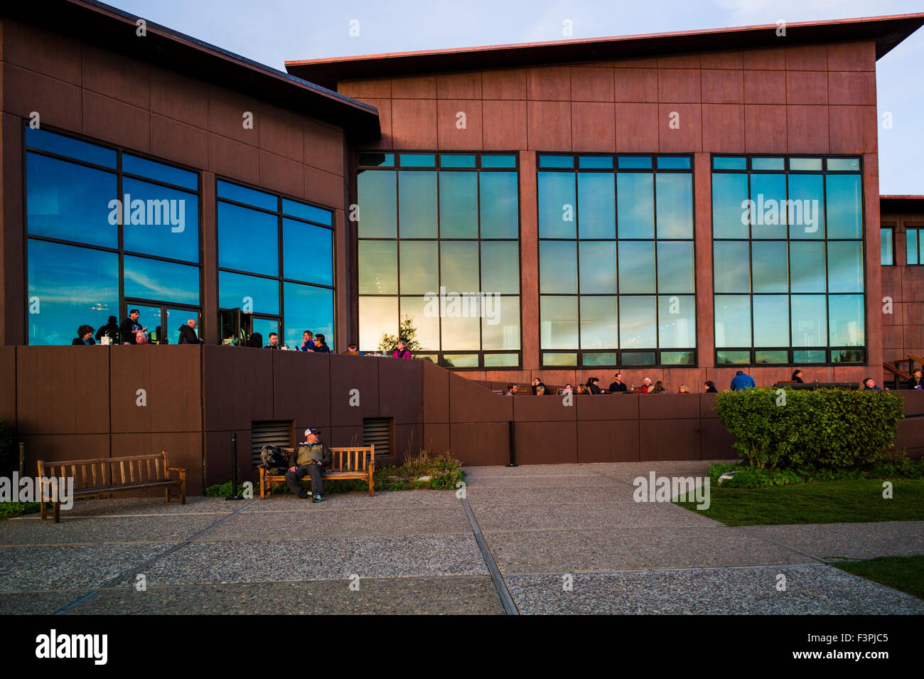 Tourists enjoy exterior sunset view of famous & historic Jackson Lake ...
