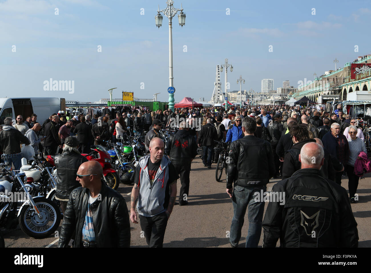 Crowds wander around Madeira Drive, Brighton, East Sussex, UK attending ...