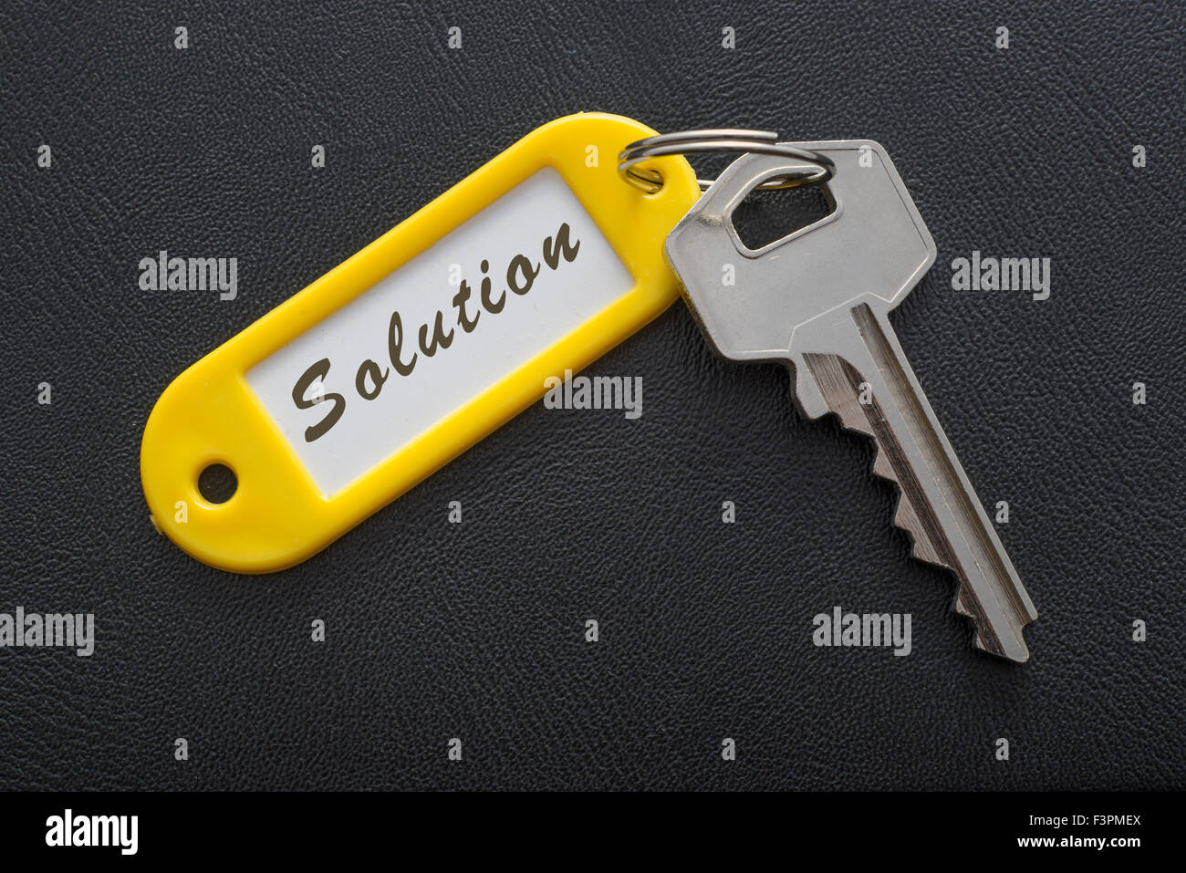 Key and label. Solution concept. Black background Stock Photo - Alamy