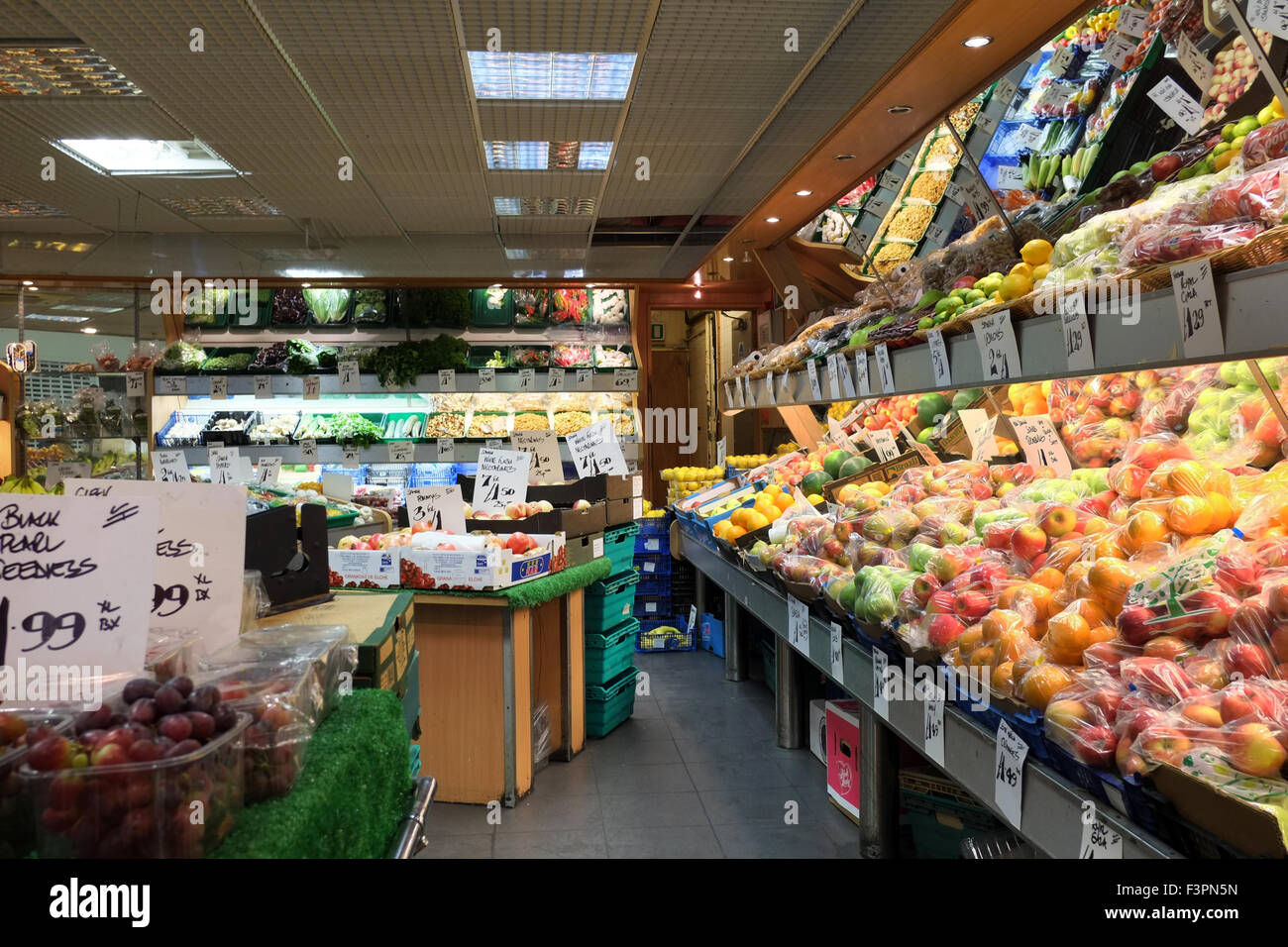 A fruit and vegetable market with a variety of market grocery produce ...