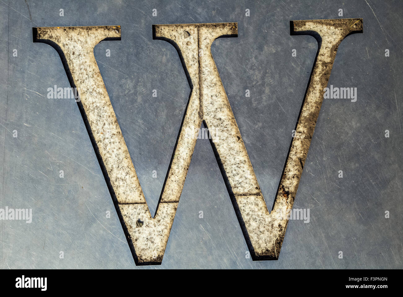 letter W cut in the metal sheet Stock Photo - Alamy