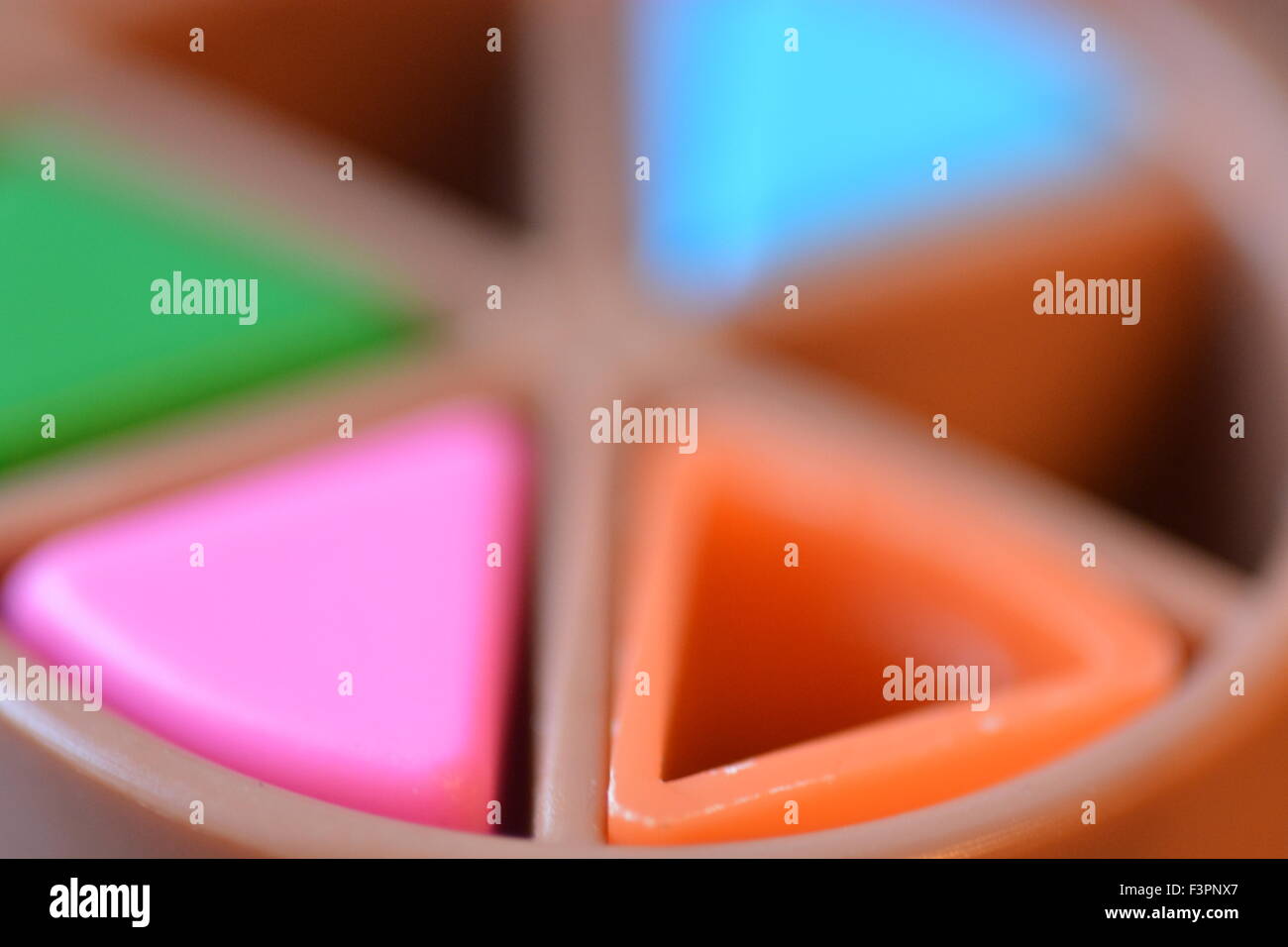 Trivial Pursuit counter with orange wedge placed upside down Stock ...