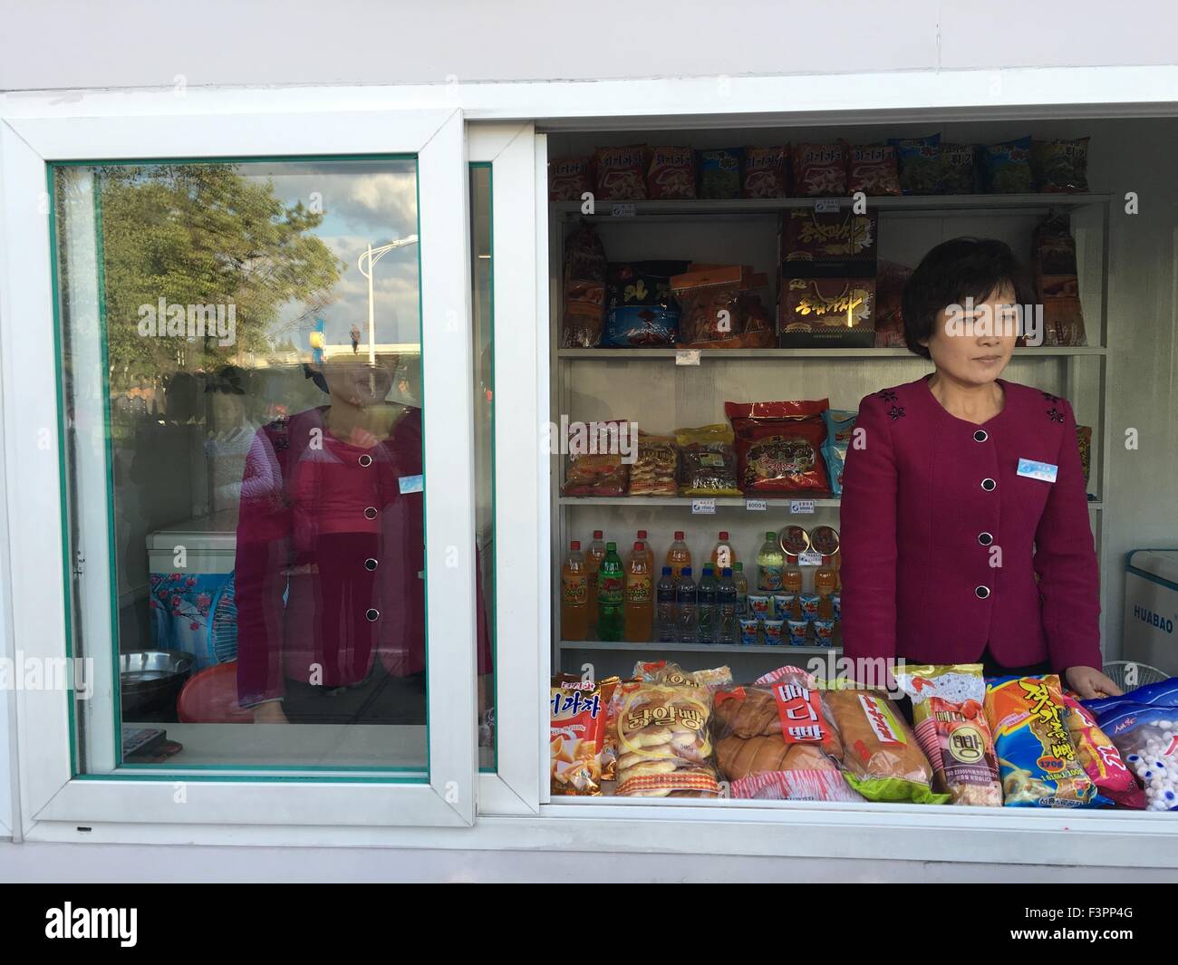 Pyongyang, North Korea. 11th Oct, 2015. Shop keepers standing in a ...