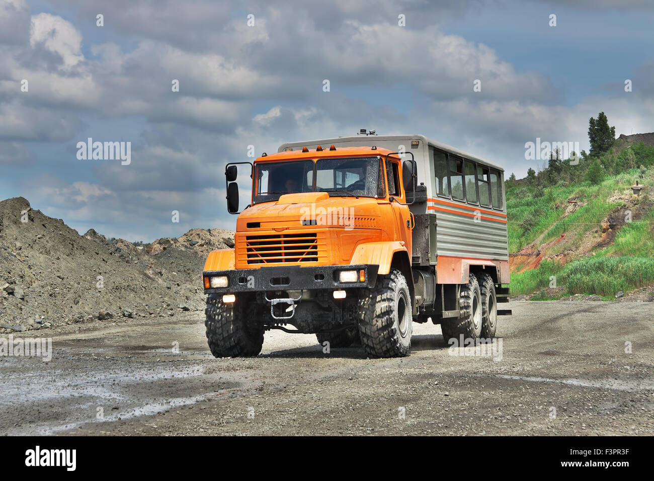Poltava Region, UKraine - June 26, 2010: Mining crew bus driving on the ...