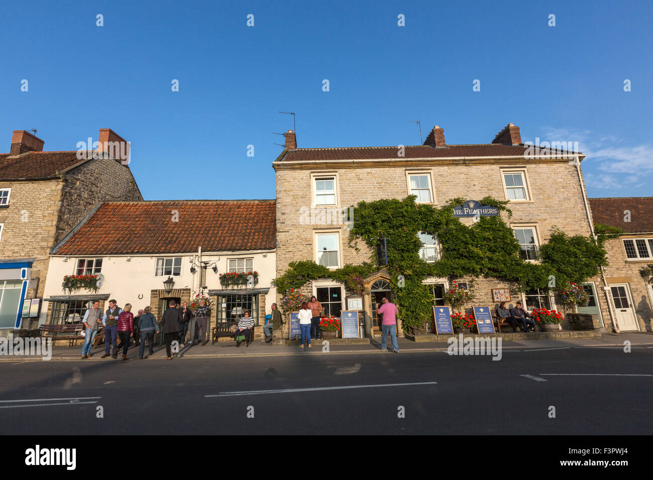 People drinking outside pubs in Helmsley Market Place, Helmsley, North ...