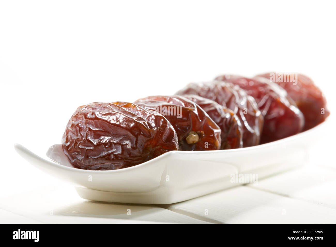 dates on a beautiful plate with free space for writing Stock Photo - Alamy