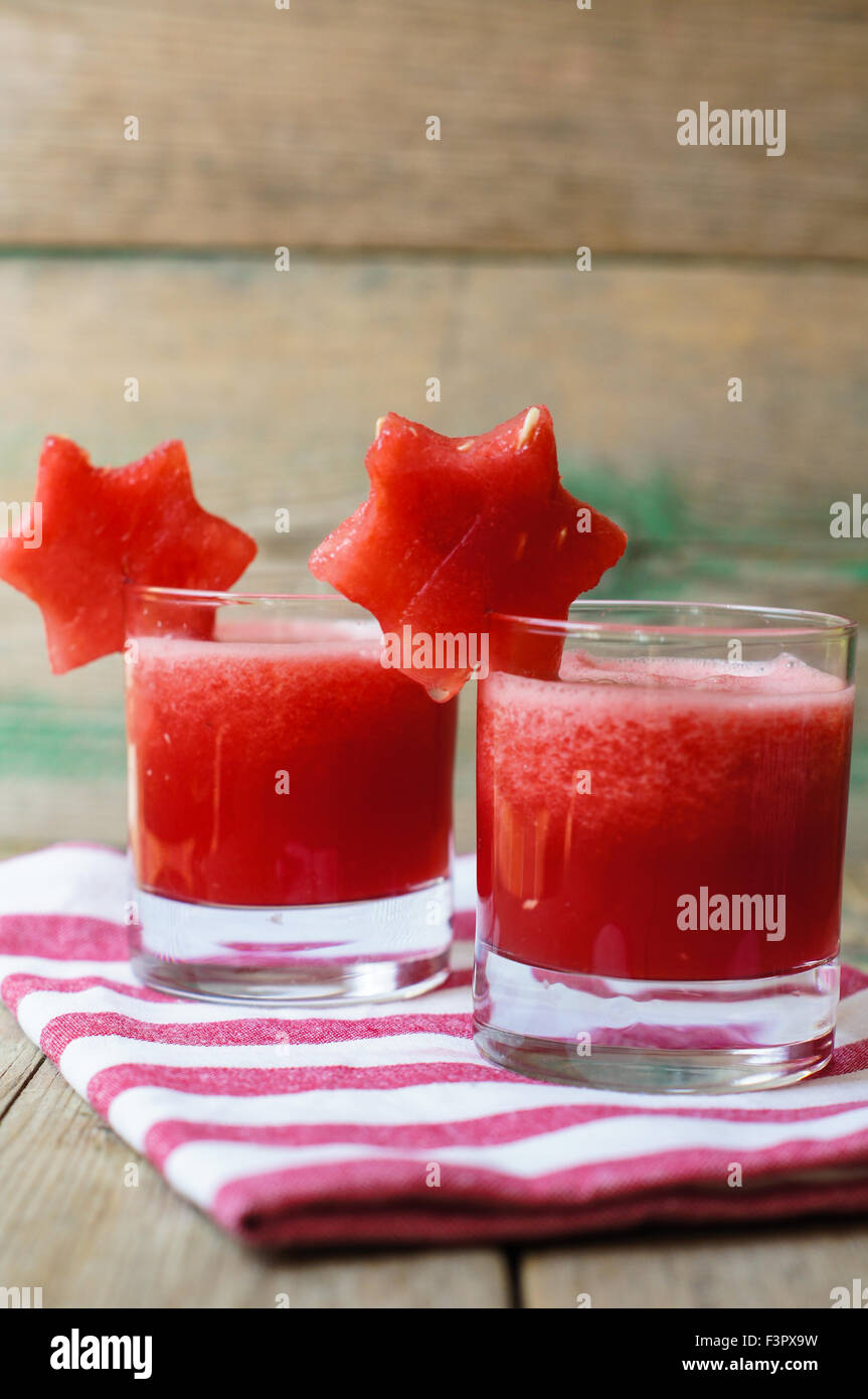 Watermelon drink in glasses with slices of watermelon in star shape ...