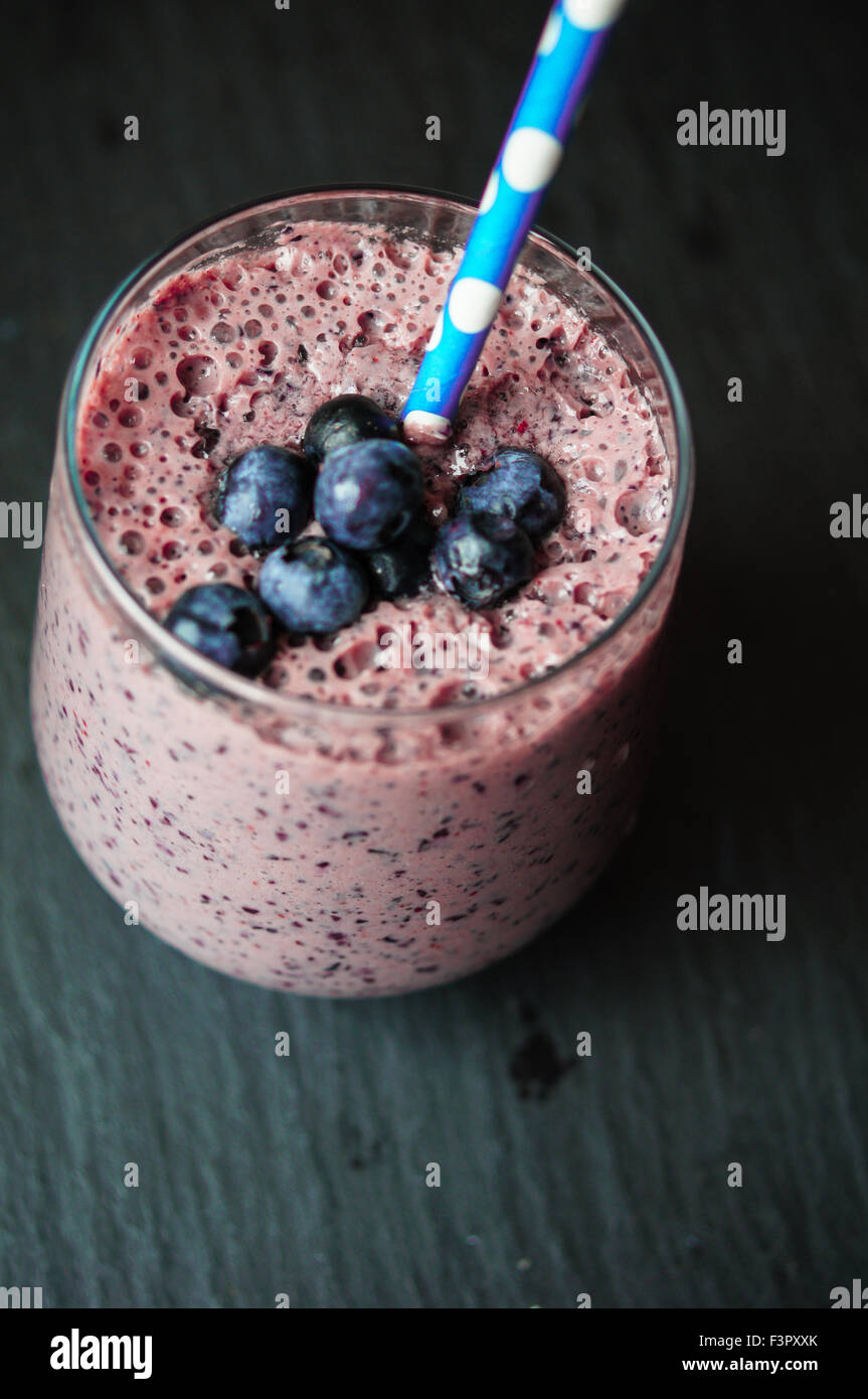 Glass with blueberry smothie, selective focus Stock Photo - Alamy