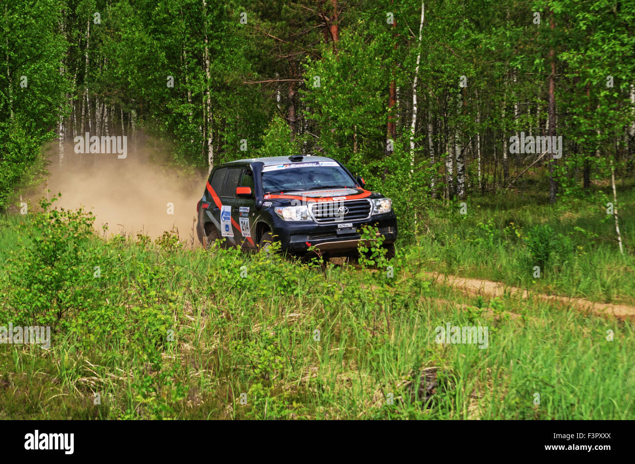 Races on a rally-raid in forest. Rally-raid Baha "Belarus" 2015 ...