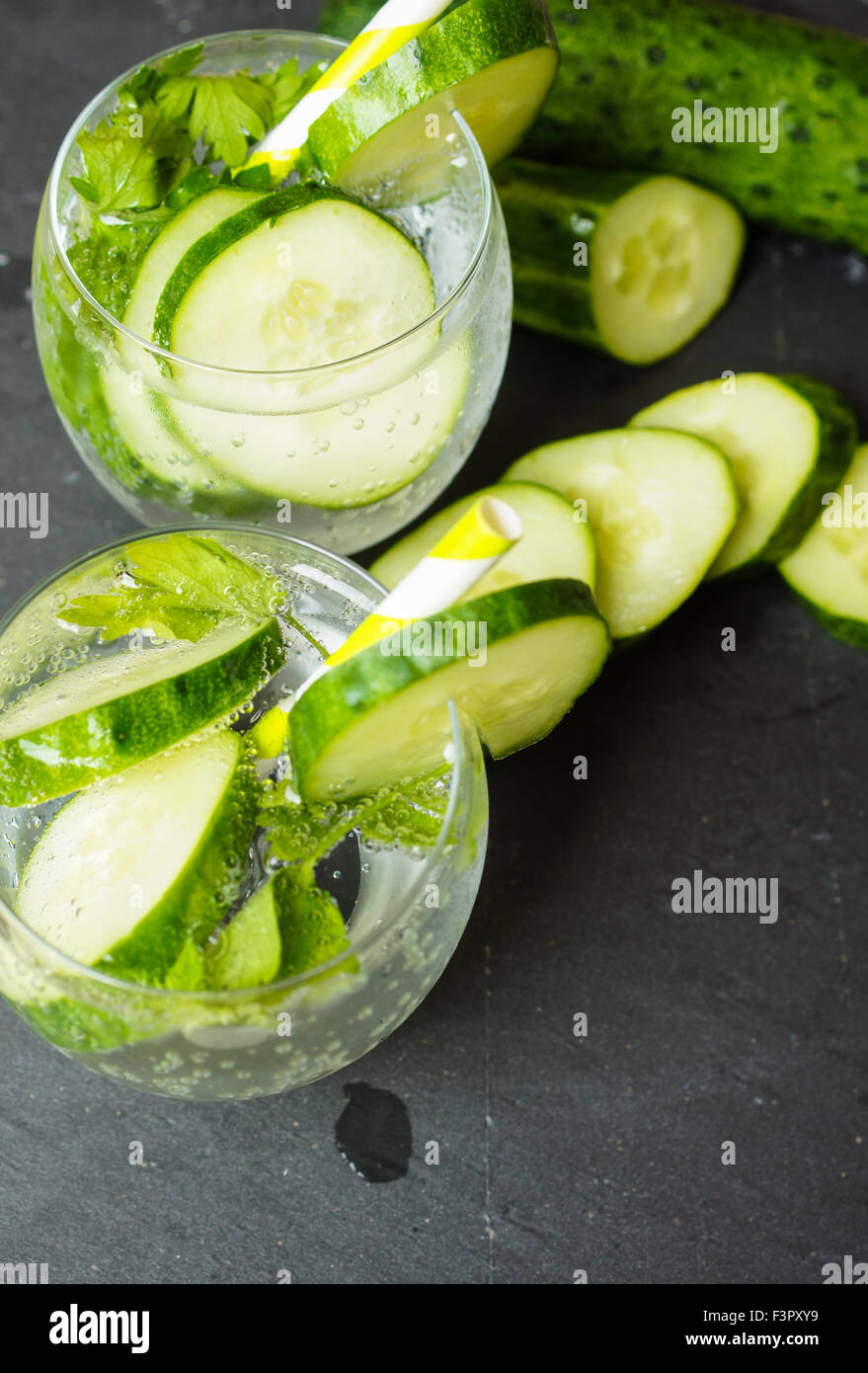 Cold fresh lemonade with cucumber and ice, selective focus Stock Photo ...