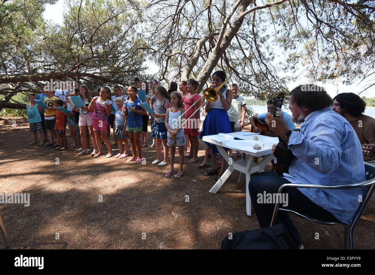 The famous professor and composer Nigel Osborne organizes a musical ...