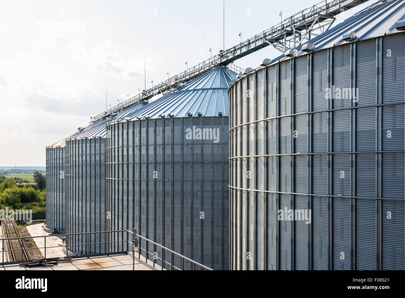 Metal grain elevator in agricultural zone Stock Photo - Alamy