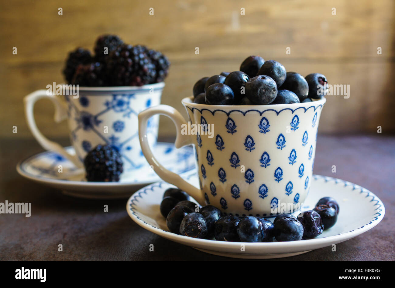 Fresh blueberry fruits in the vintage cups Stock Photo - Alamy