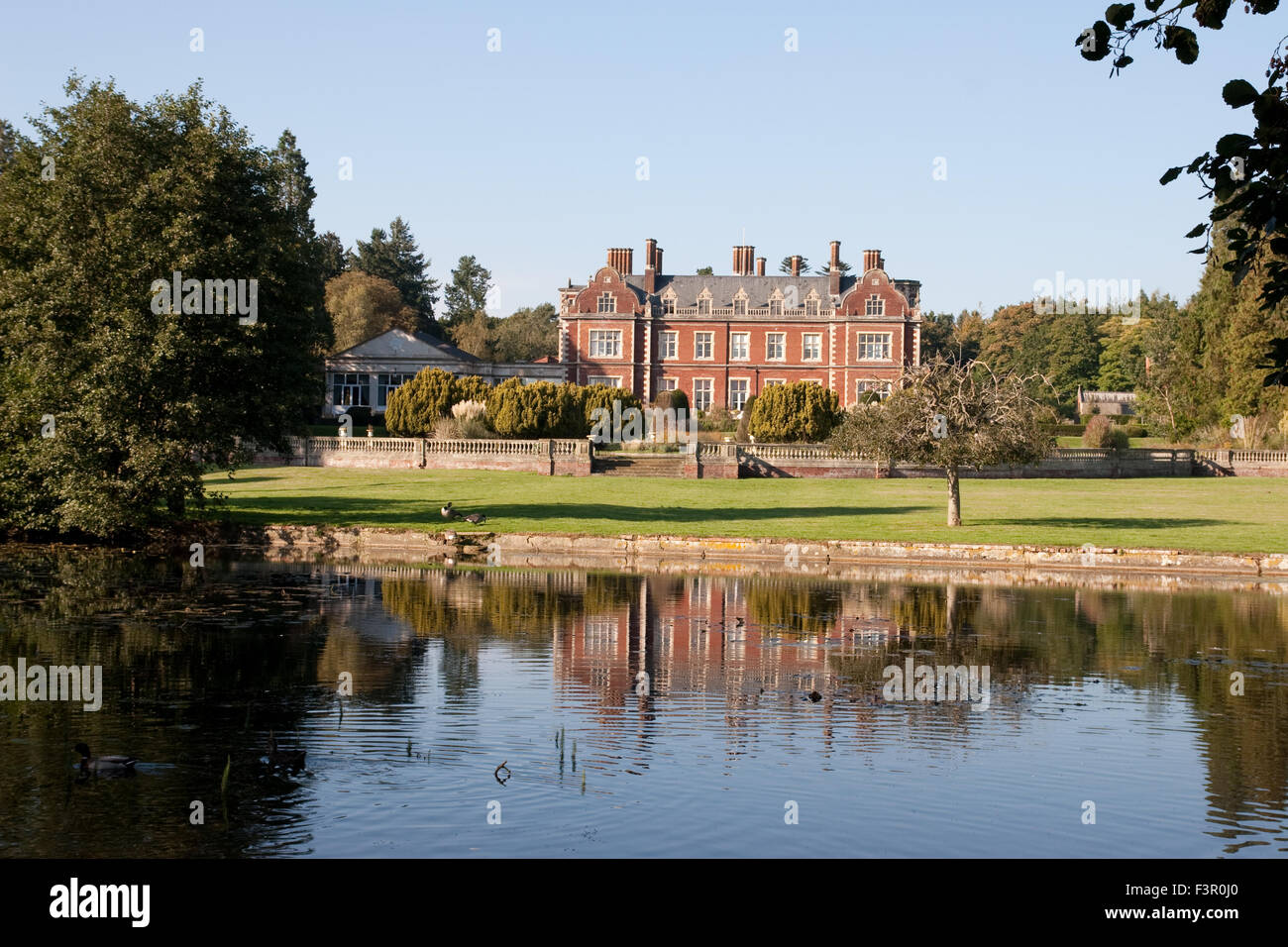 Lynford Hall hotel view from across the lake Stock Photo - Alamy