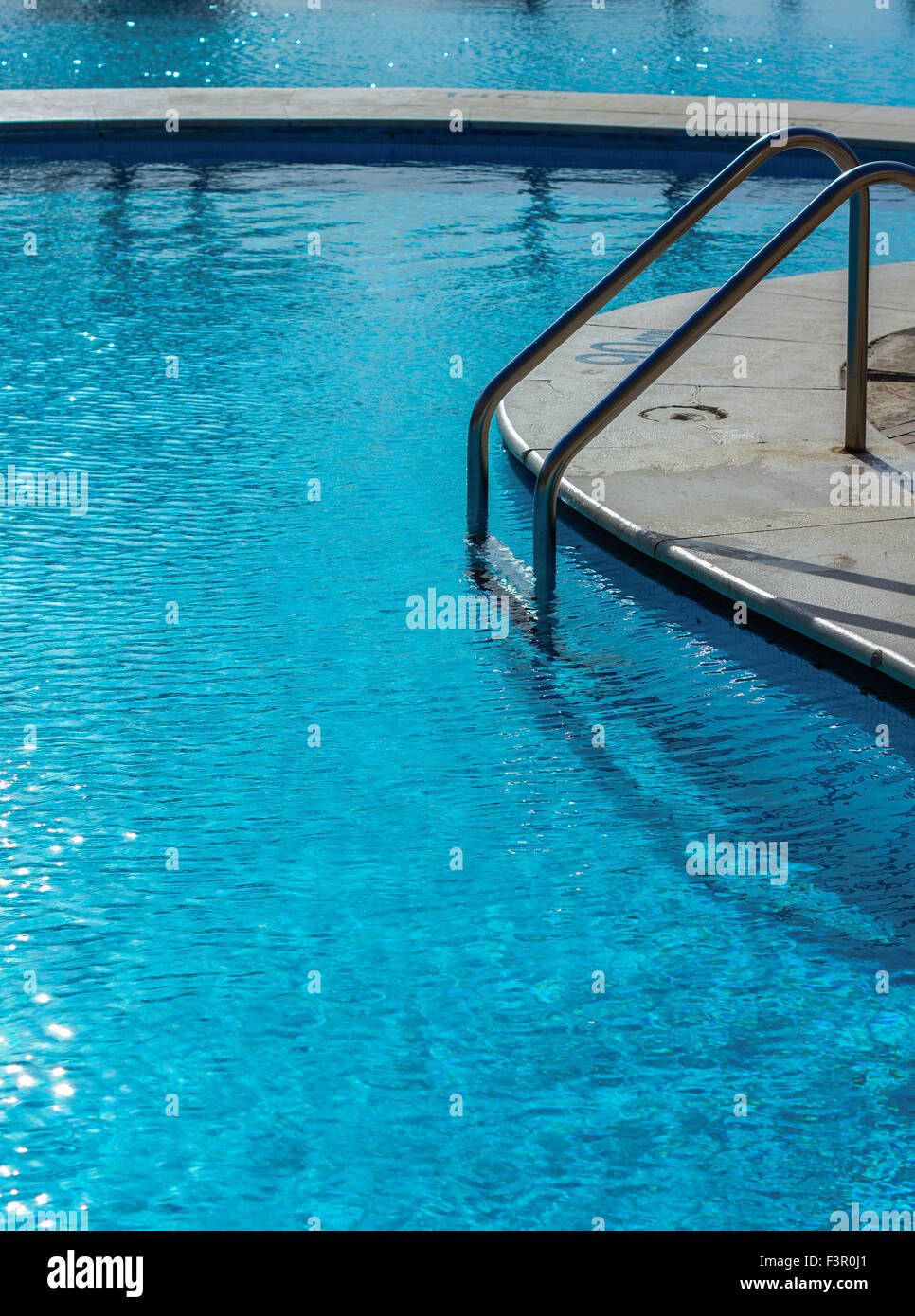 blue swimming pool with teak wood flooring stripes summer vacation ...