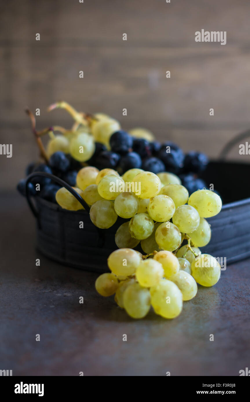 Ripe grape fruits on the dark vintage kitchen background Stock Photo ...