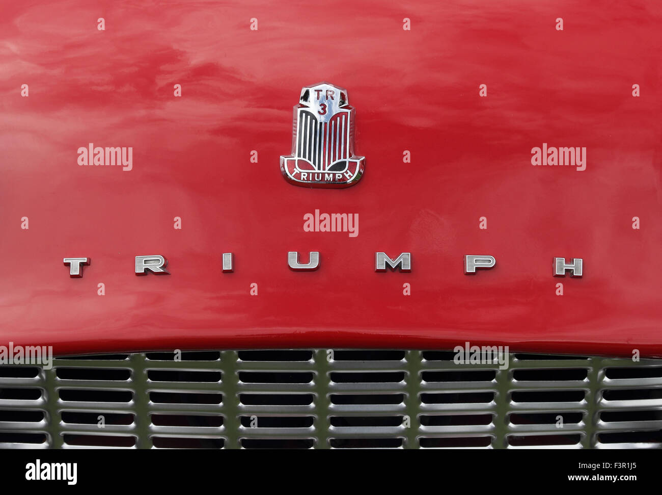 Badges on bonnet of red 1962 Triumph TR3 sports car Stock Photo - Alamy