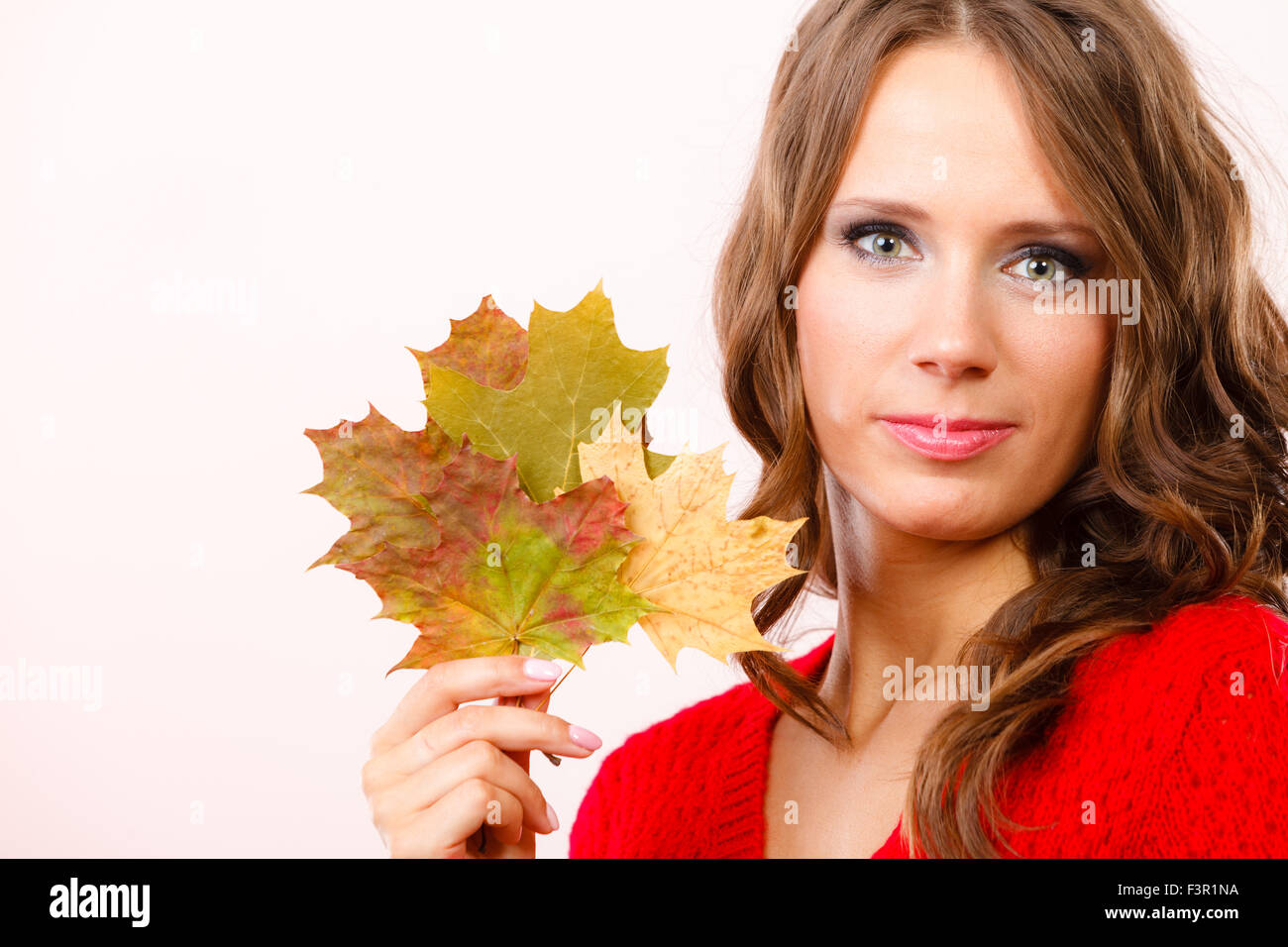 Beauty female autumnal model. Pretty girl long hair with maple leaves ...
