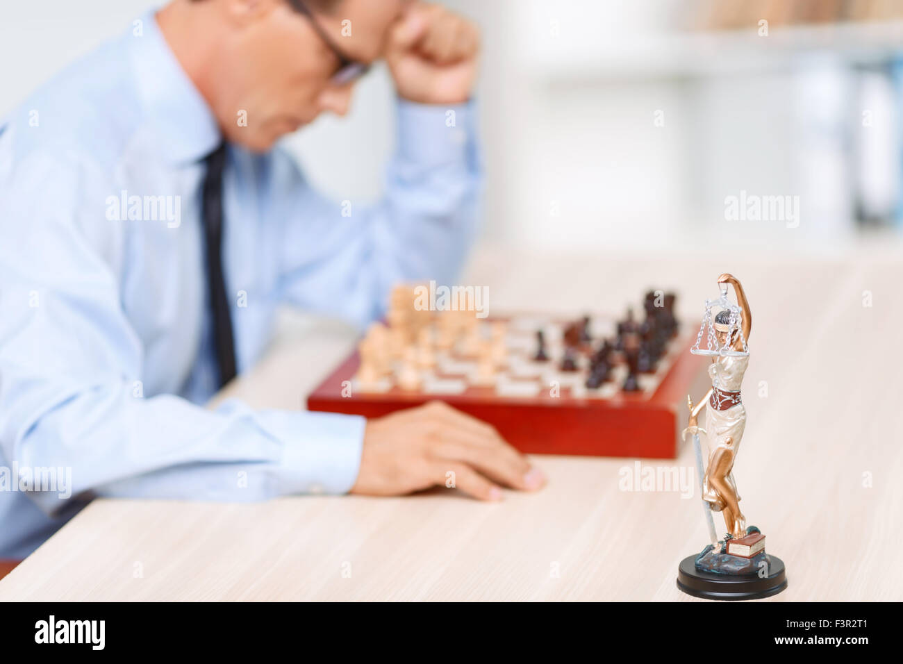 Professional lawyer playing chess Stock Photo - Alamy