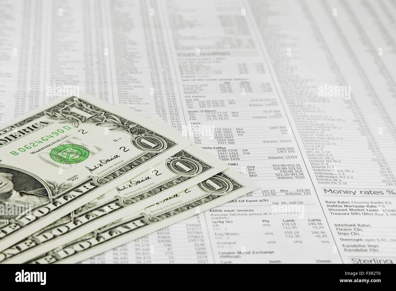 American One Dollar bank notes on a News paper Stock market financial ...